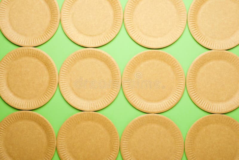 Disposable Cardboard Plates on a Green Table Stock Image - Image of ...