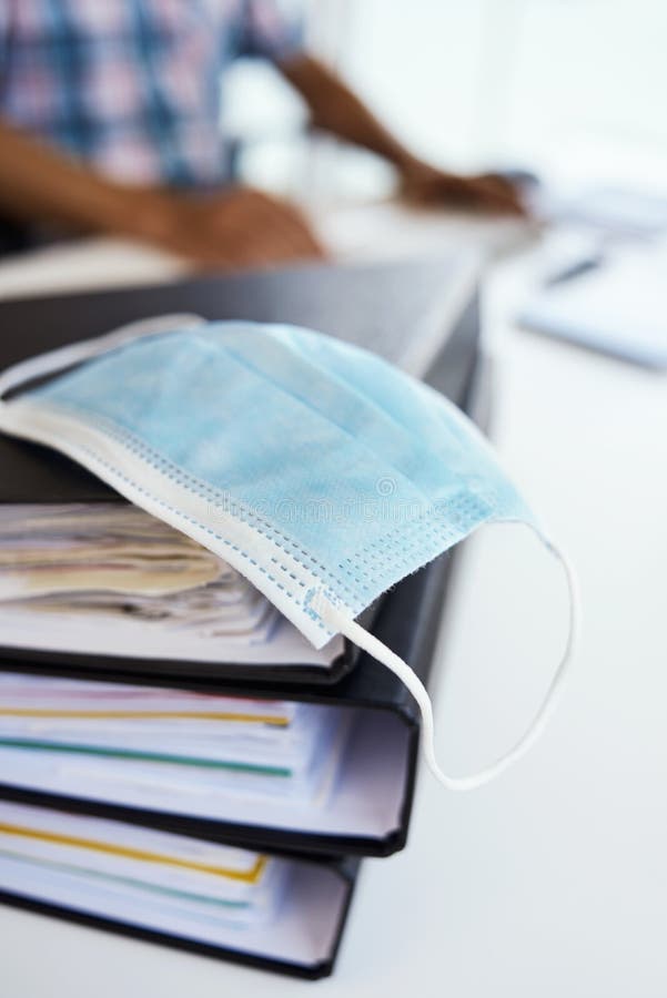 Disposable Face Mask on an Office Desk Stock Photo - Image of ...