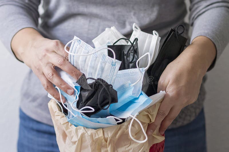Disposable mask in the bin stock photo. Image of covid - 219836300