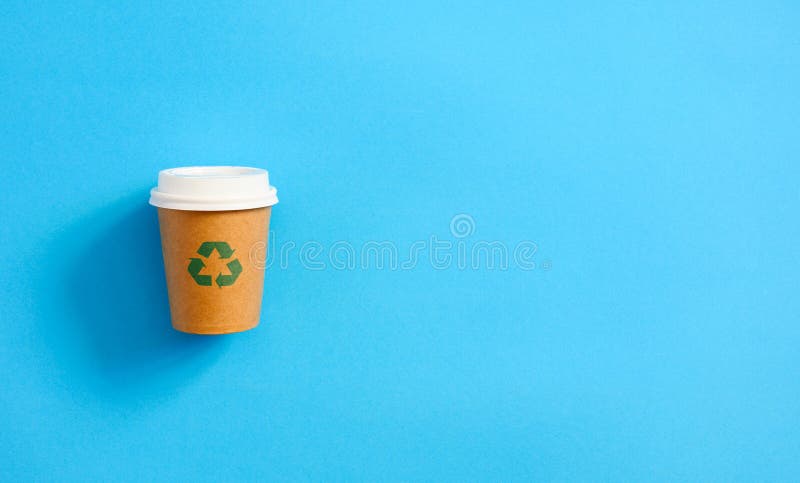 Disposable Paper Cup with a Recycling Sign on a Blue Background. the ...
