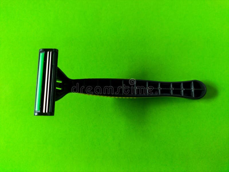 Green Disposable Razor on Green Background Stock Photo - Image of ...