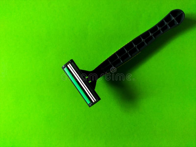 Green Disposable Razor on Green Background Stock Image - Image of ...