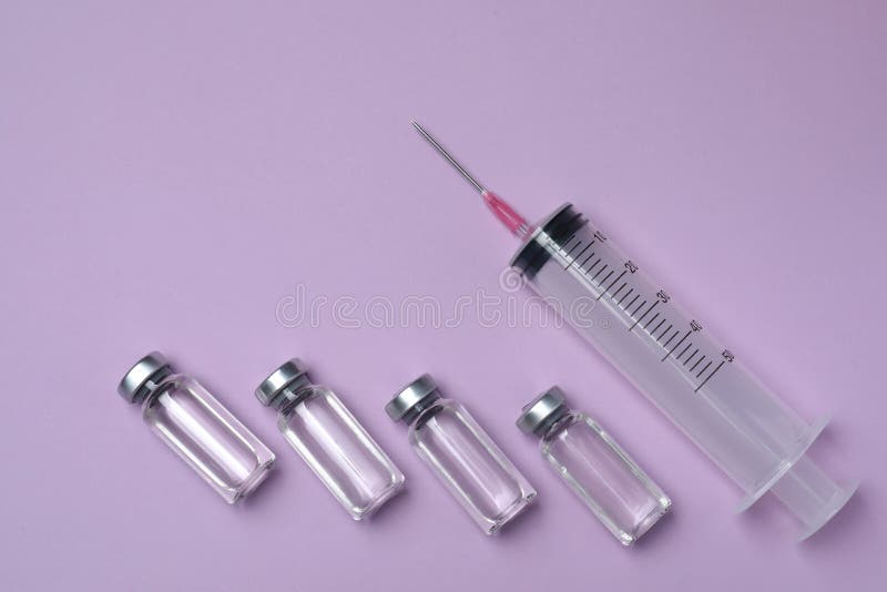 Disposable Syringe with Needle and Vials on Violet Background, Flat Lay ...