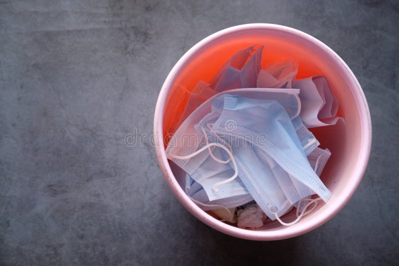 Dispose the Medical Face Mask To Bin or Trash Can Stock Photo - Image ...