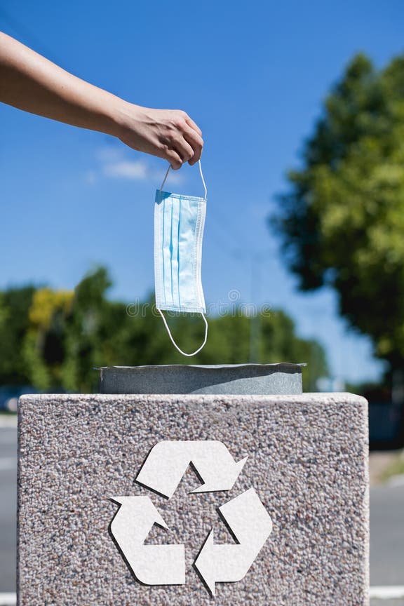 Disposing of Protective Mask in Recycle Bin Stock Photo - Image of ...
