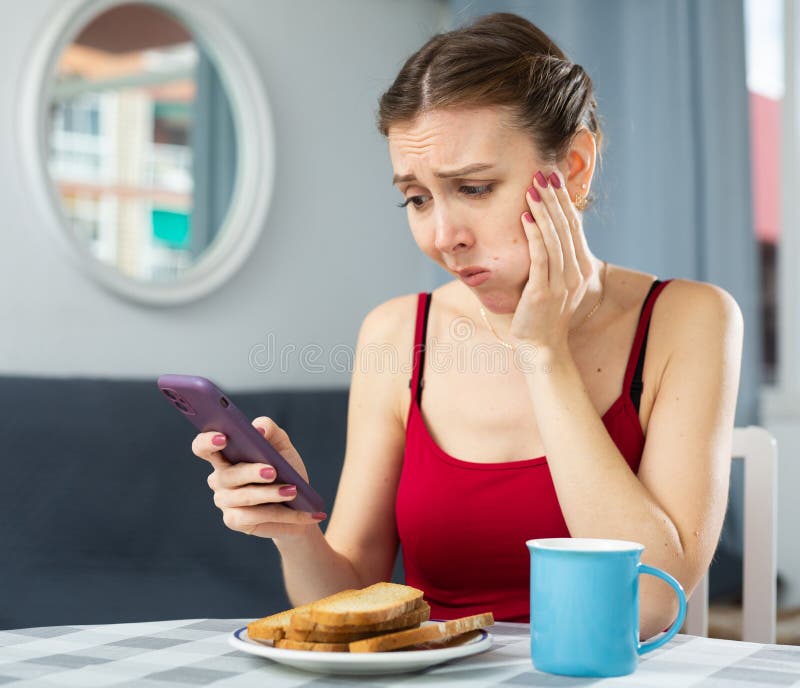 Dissatisfied Woman with Toothache Sitting at Dinner Table Stock Photo ...
