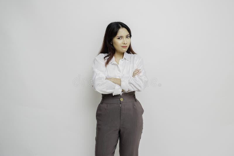 A Dissatisfied Young Asian Woman Looks Disgruntled Wearing White Shirt ... A Dissatisfied Young Asian Woman Looks Disgruntled Wearing White Shirt ...