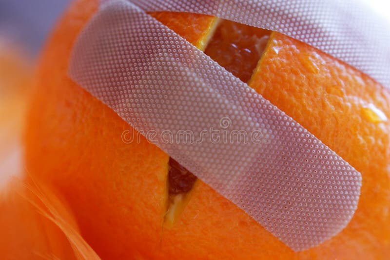 Dissected Damaged Cut Orange Stuck with a Plaster and Dressing Stock ...