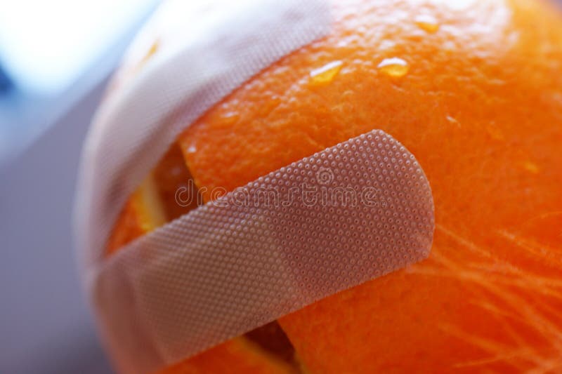 Dissected Damaged Cut Orange Stuck with a Plaster and Dressing Stock ...