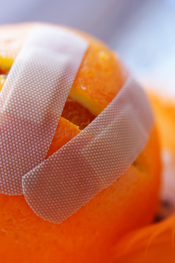 Dissected Damaged Cut Orange Stuck with a Plaster and Dressing Stock ...