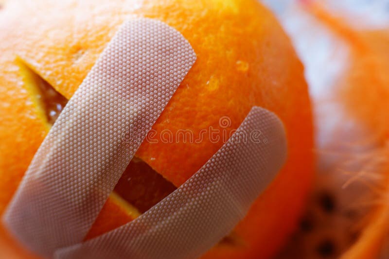 Dissected Damaged Cut Orange Stuck with a Plaster and Dressing Stock ...