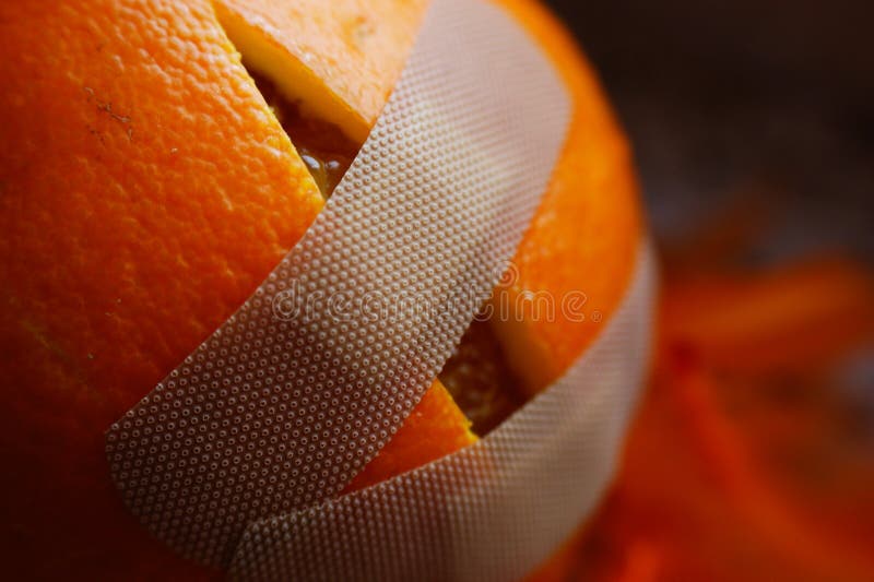 Dissected Damaged Cut Orange Stuck with a Plaster and Dressing Stock ...