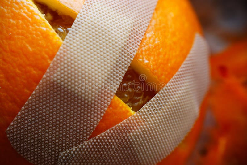 Dissected Damaged Cut Orange Stuck with a Plaster and Dressing Stock ...