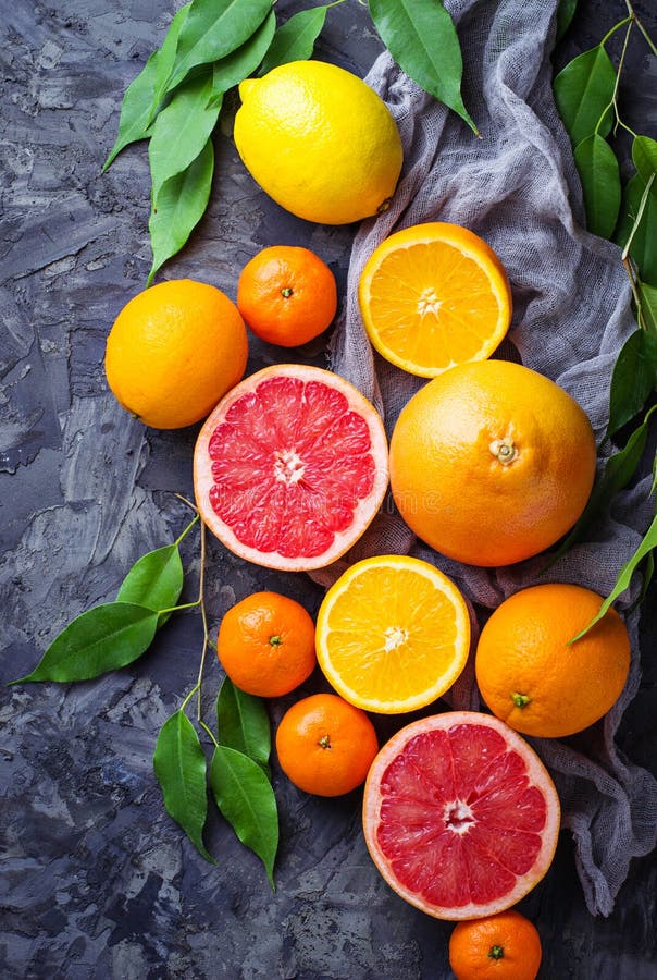 Dissected Fresh Fruits. Orange, Grapefruit and Tangerines Stock Photo ...