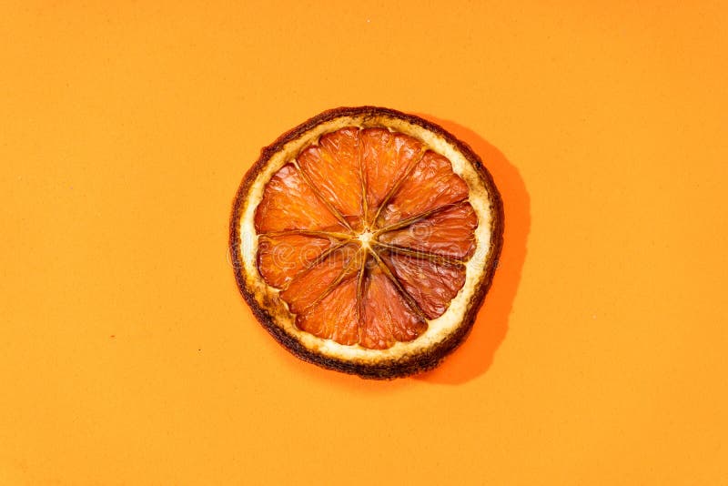 Dissected Orange Slice on a Orange Surface Stock Photo - Image of ...