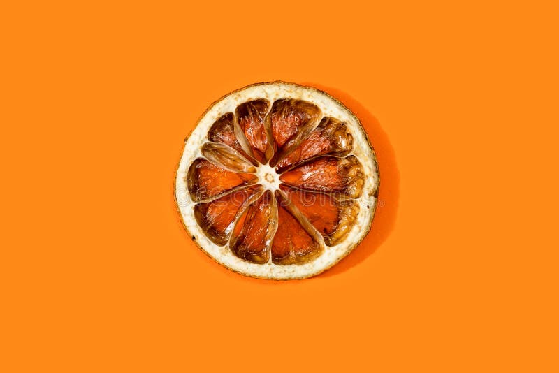 Dissected Orange Slice on a Orange Surface Stock Photo - Image of lemon ...