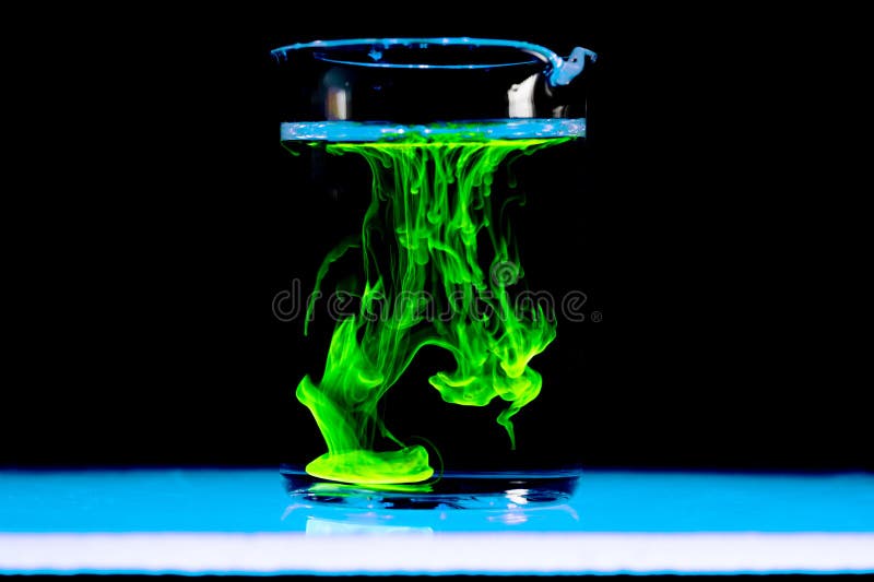 Dissolution and Spread of a Green Substance in a Flask with a Clear ...