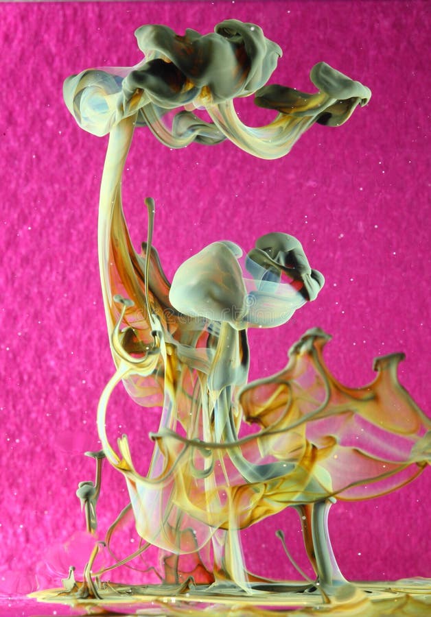 Dissolving ink on pink stock image. Image of pink, colours - 12771091