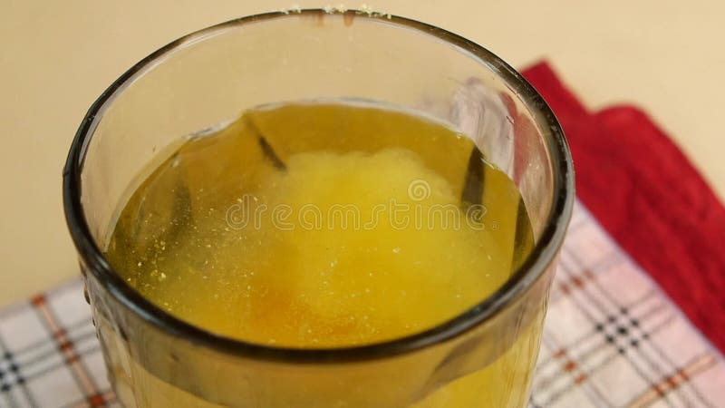 Dissolving Lemon Powder in a Glass of Water Stock Video - Video of ...
