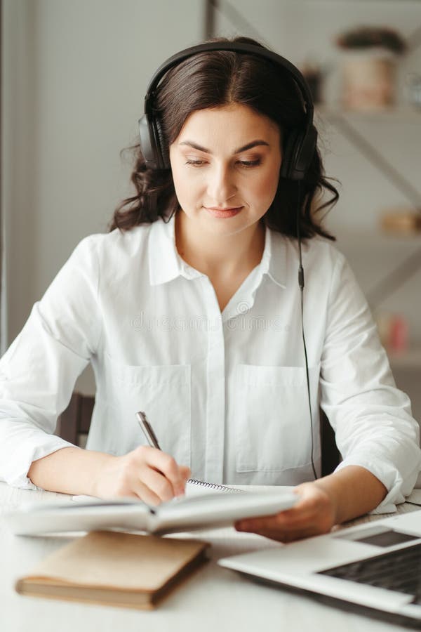 Woman in Headphones Work on Laptop Making Notes Stock Photo - Image of ...