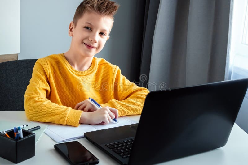 Distance Learning, a Boy Learns Math while Looking at a Laptop Beech ...