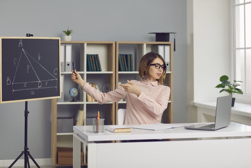 Math Teacher Sits in the Classroom and Explains a New Lesson Topic ...