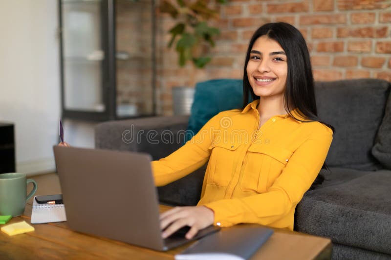 Distance Learning. Happy Spanish Lady Using Laptop Computer, Smiling at ...