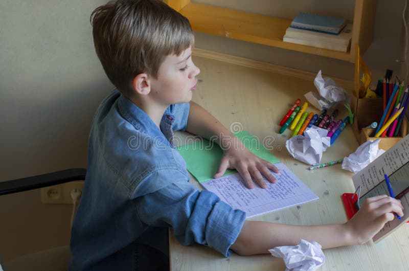 Serious Schoolboy Studying at Home during Quarantine. Stock Photo ...