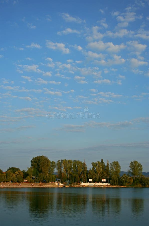 Distant beach stock image. Image of dusk, water, tree - 6193563