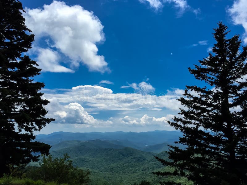 Distant Mountain Viewed through Tree Clearing Stock Image - Image of ...