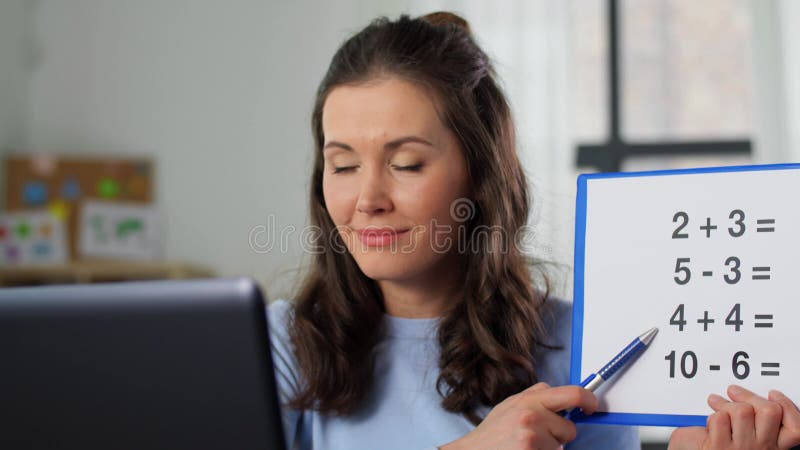Math Teacher Having Online Class on Laptop at Home Stock Footage ...