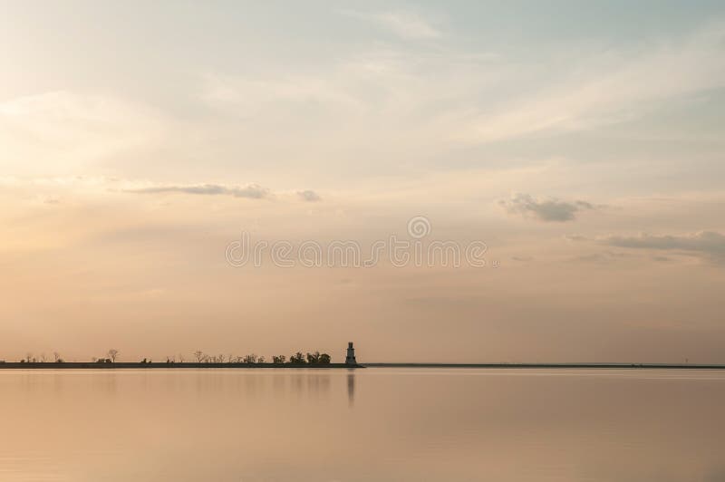 Distant Lighthouse on the Dam at Sunset Stock Image - Image of poetry ...