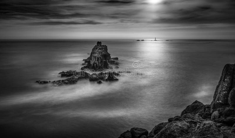 Distant Lighthouse, Lands End, West Cornwall, UK Stock Photo - Image of ...