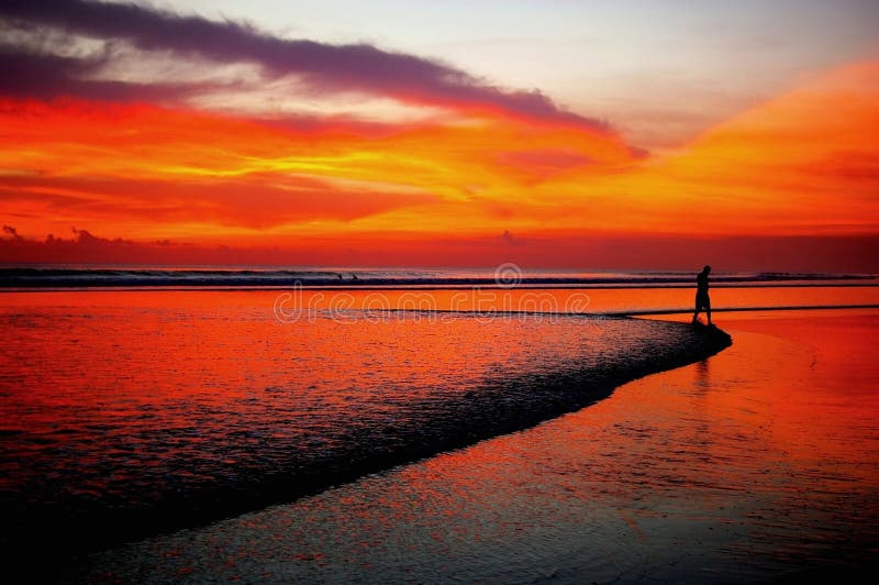 Distant Man Walking on Beach at Sunset Stock Image - Image of ocean ...