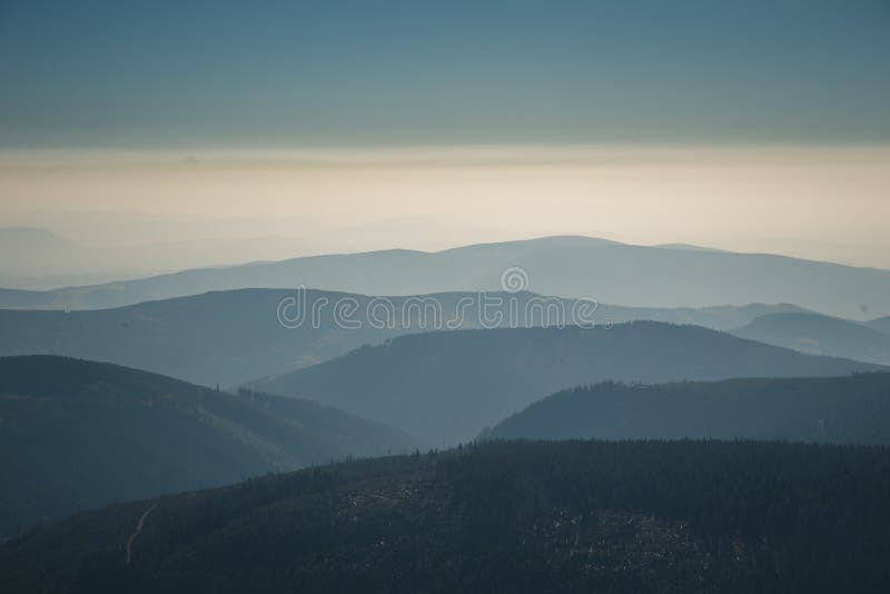 Distant Mountain Range and Thin Layer of Clouds on the Valleys. Stock ...