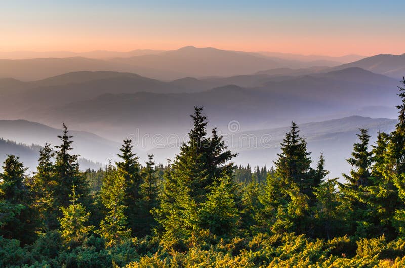 Distant Mountain Range And Thin Layer Of Clouds On The Valleys Stock ...