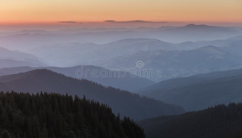 Distant Mountain Range and Thin Layer of Clouds on the Valleys Stock ...