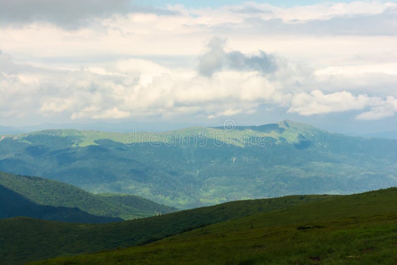 Distant Mountain Ridge in Clouds Stock Image - Image of divide, land ...