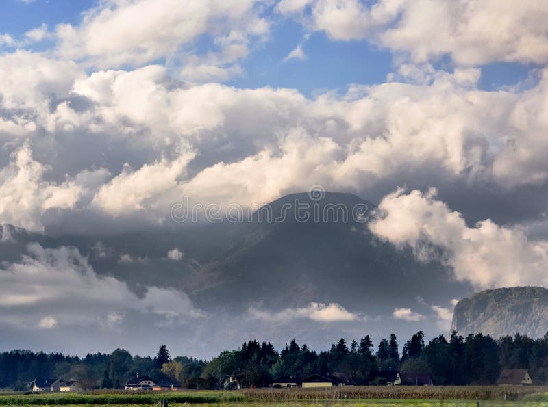 Distant Mountains in Clouds Stock Photo - Image of mountains, adventure ...