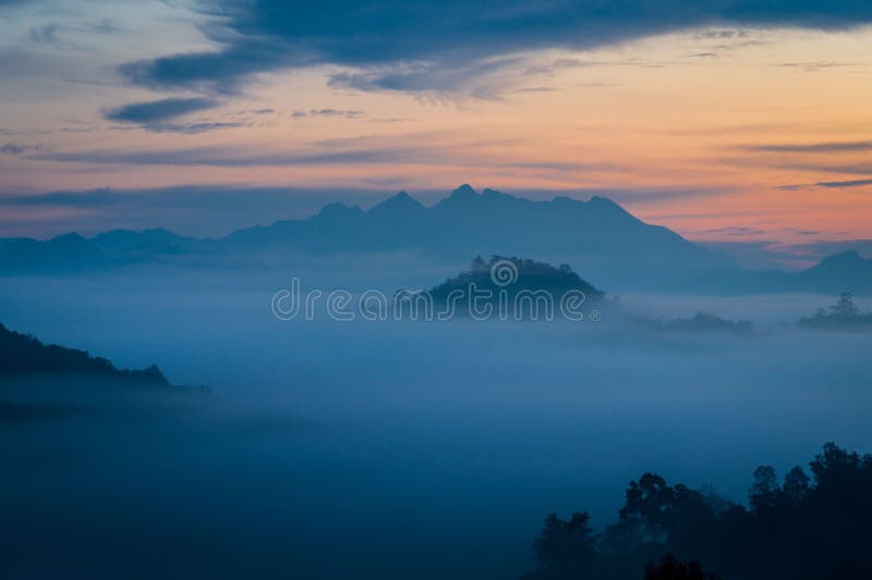 Mountains covered in mist stock image. Image of hill - 255173649
