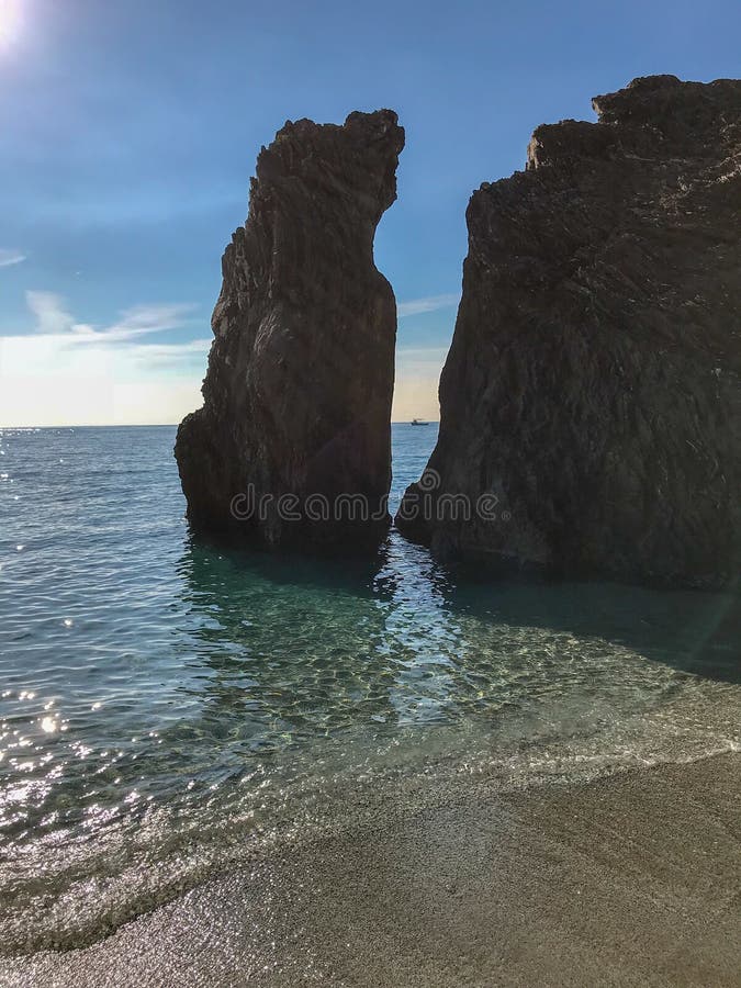 Distant Ship Visible between Rock Formations on Monterosso Al Ma ...