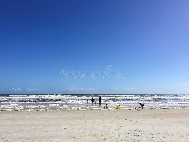 Distant Shot of Family on a Beach Stock Image - Image of support ...