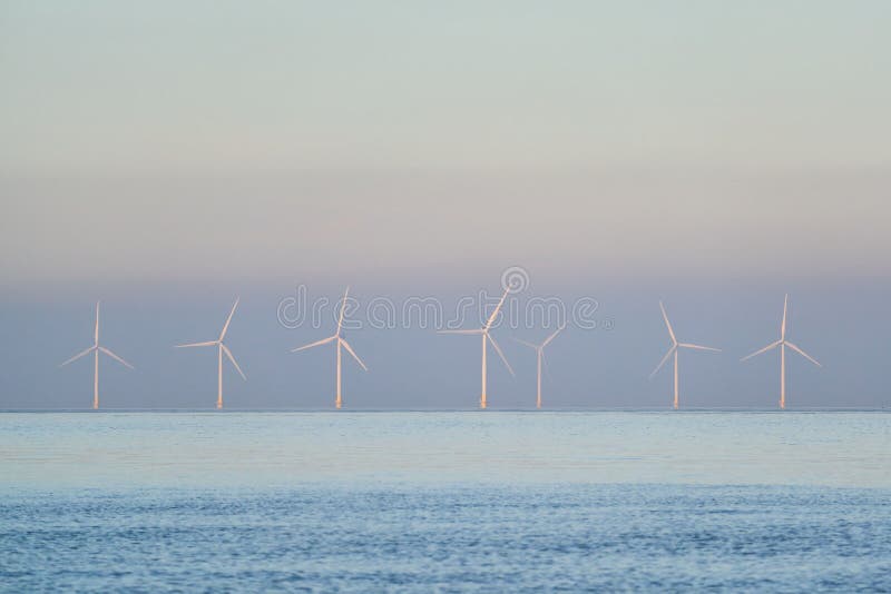 Distant Shot of Offshore Wind Energy Farm of Seven Windmills in the ...