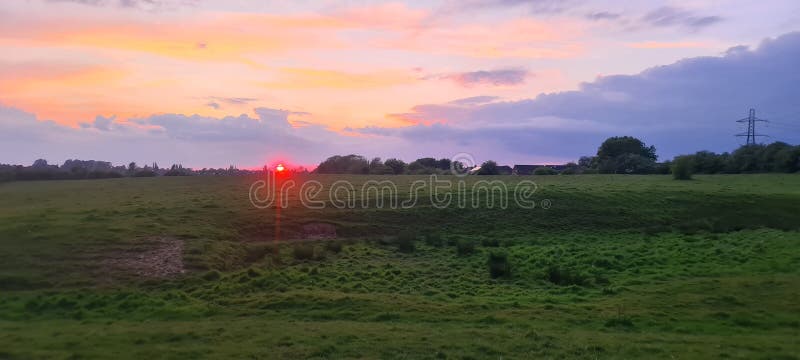 A distant sunset stock photo. Image of dawn, plain, sunrise - 260507236