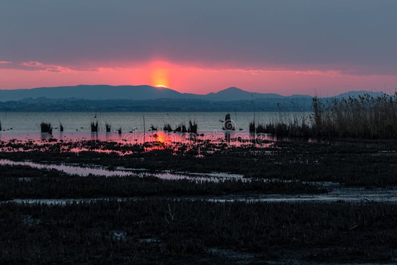 A distant sunset stock photo. Image of dawn, plain, sunrise - 260507236