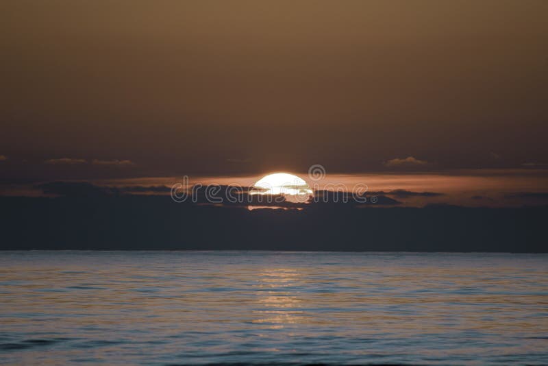 A distant sunset stock photo. Image of dawn, plain, sunrise - 260507236