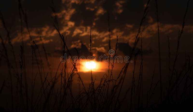 A distant sunset stock photo. Image of dawn, plain, sunrise - 260507236