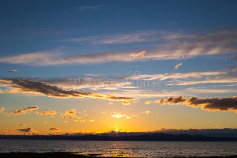 A distant sunset stock photo. Image of dawn, plain, sunrise - 260507236