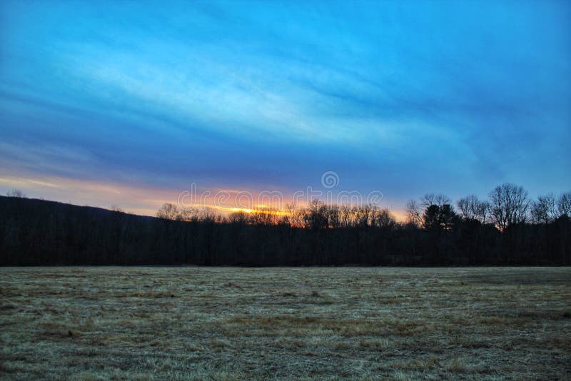 A distant sunset stock photo. Image of dawn, plain, sunrise - 260507236