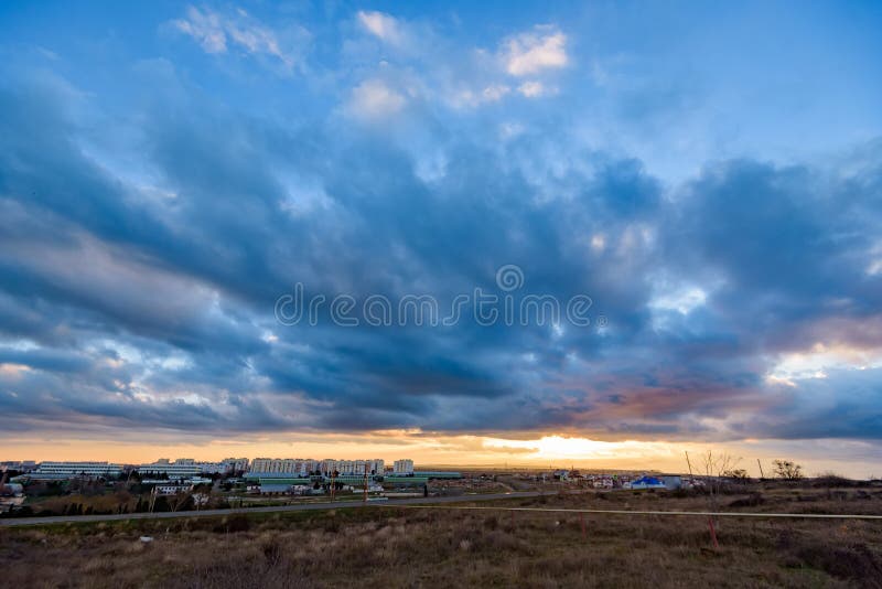Distant View of City and Dramatic Skyscape with Clouds Stock Photo ...